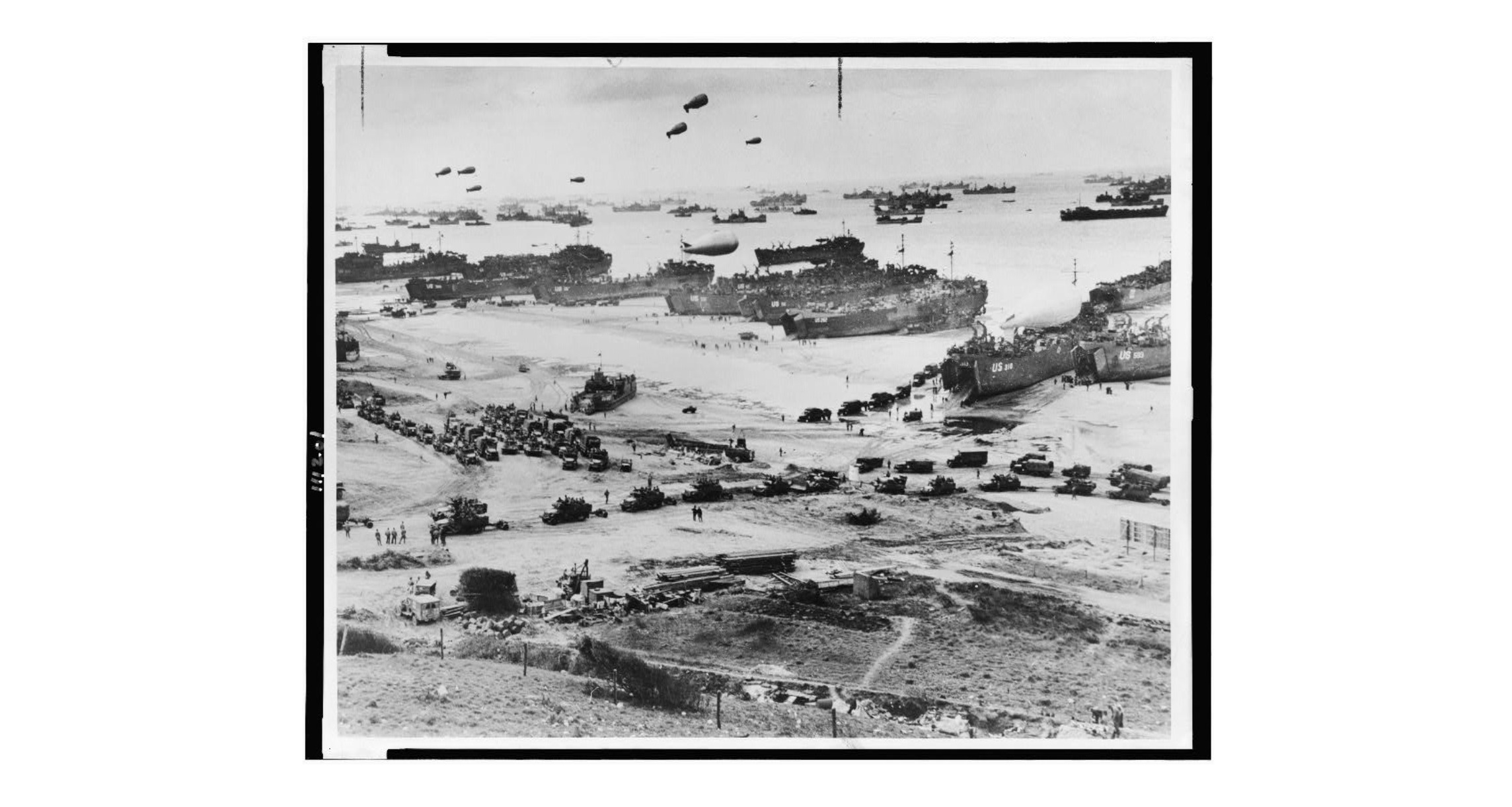 [Bird's-eye view of landing craft, barrage balloons, and allied troops ...