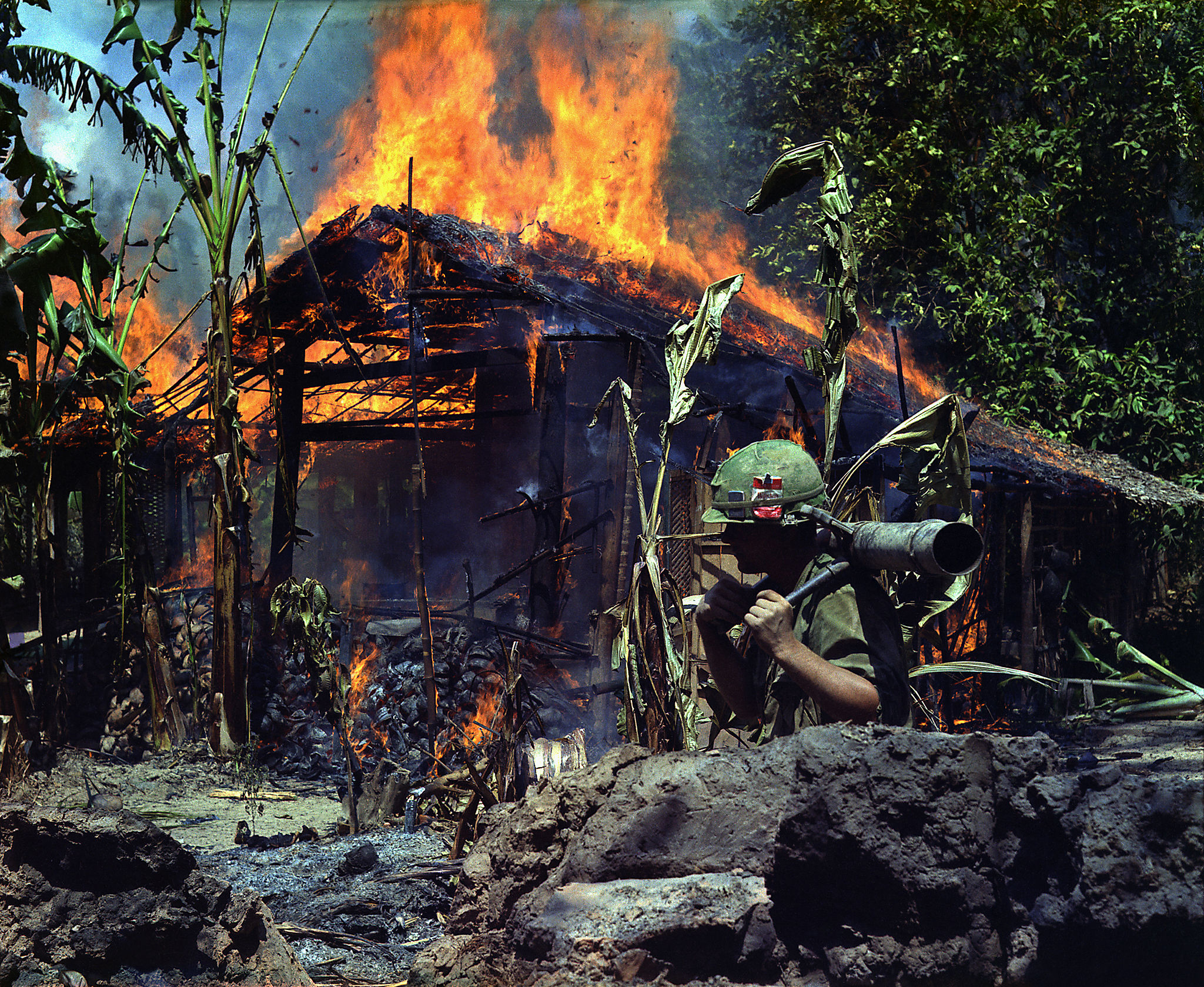A Viet Cong base camp being burned down · Santa Clara University ...